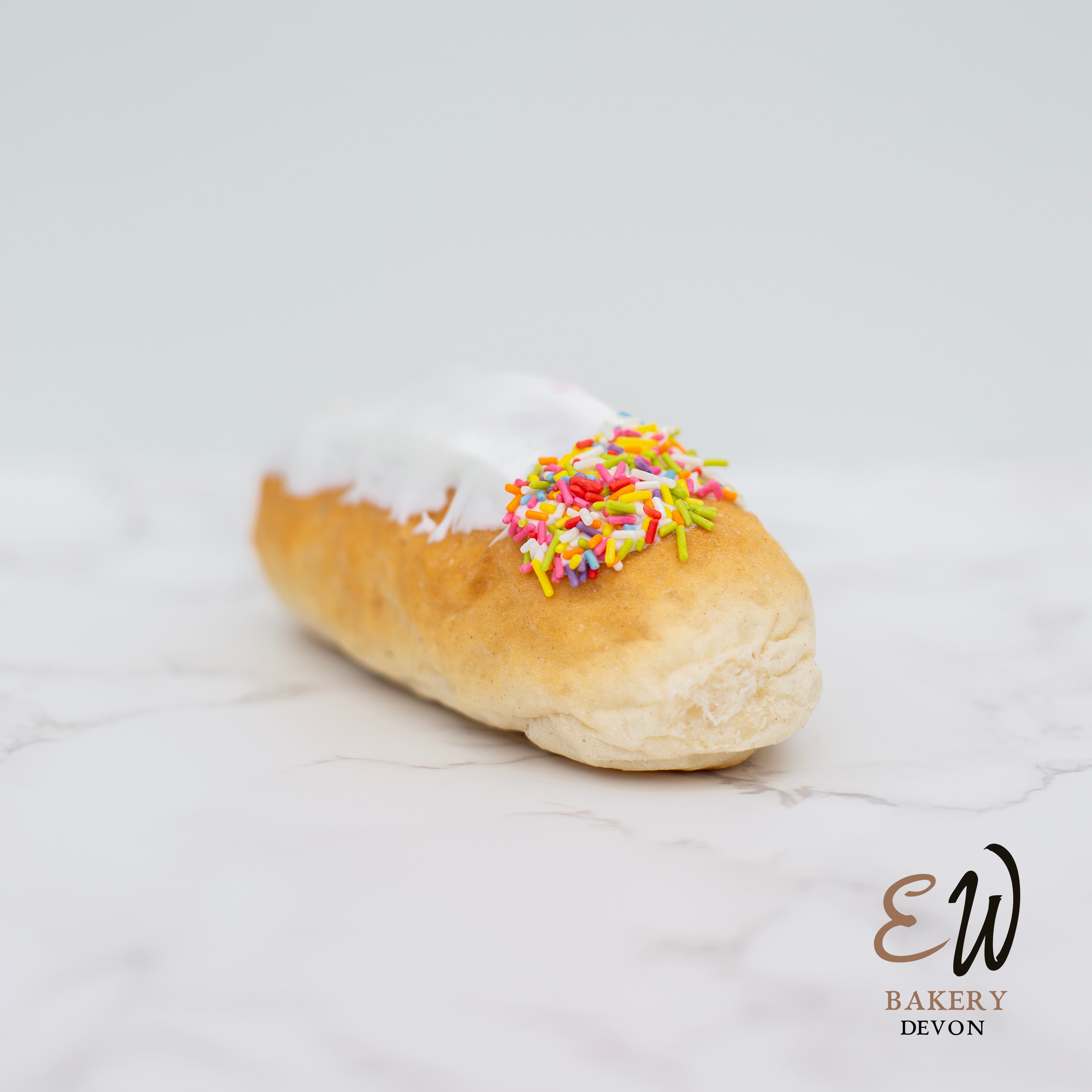 Iced Finger Bun – East and West Bakery